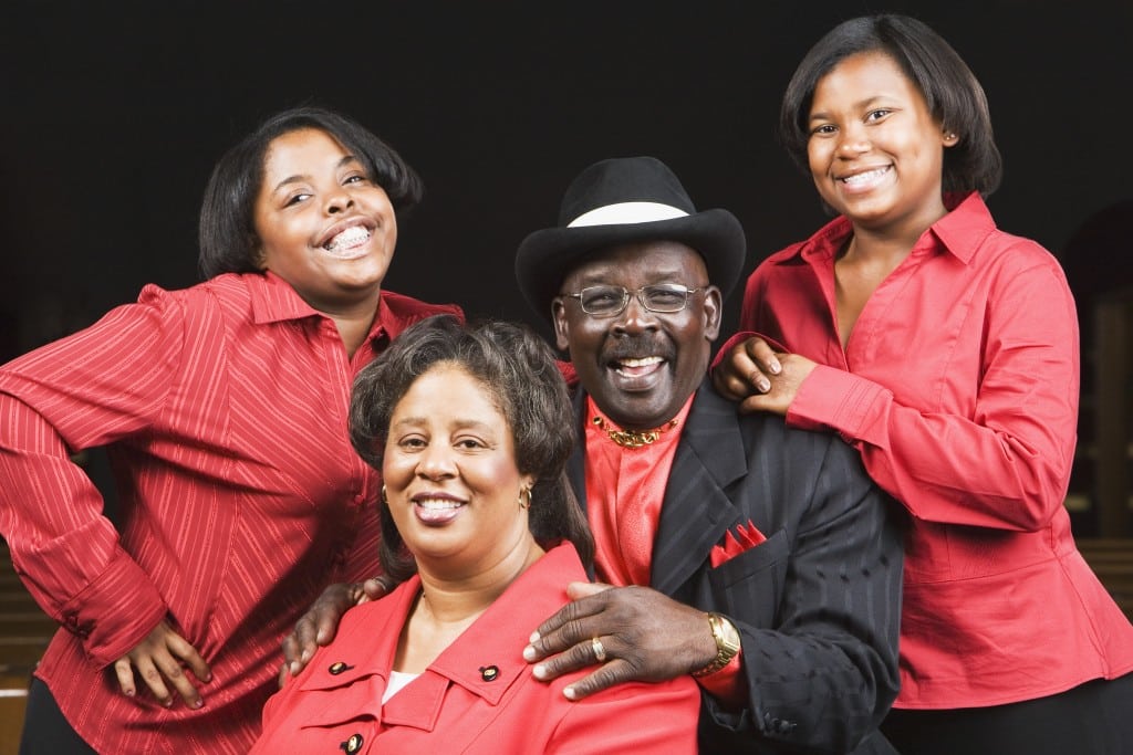 Portrait of African family wearing matching clothing - Jay Harold