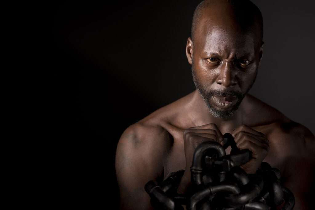 Bare Chested Black Man In Chains - Jay Harold